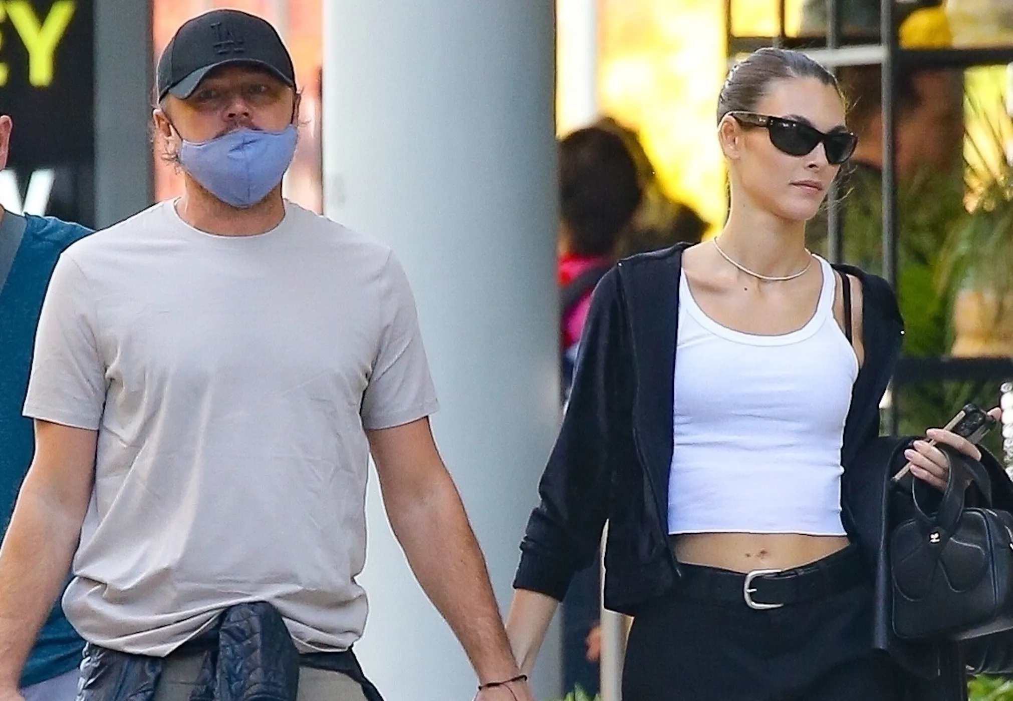 Leonardo DiCaprio and Vittoria Ceretti hold hands while walking in New York - MustHub